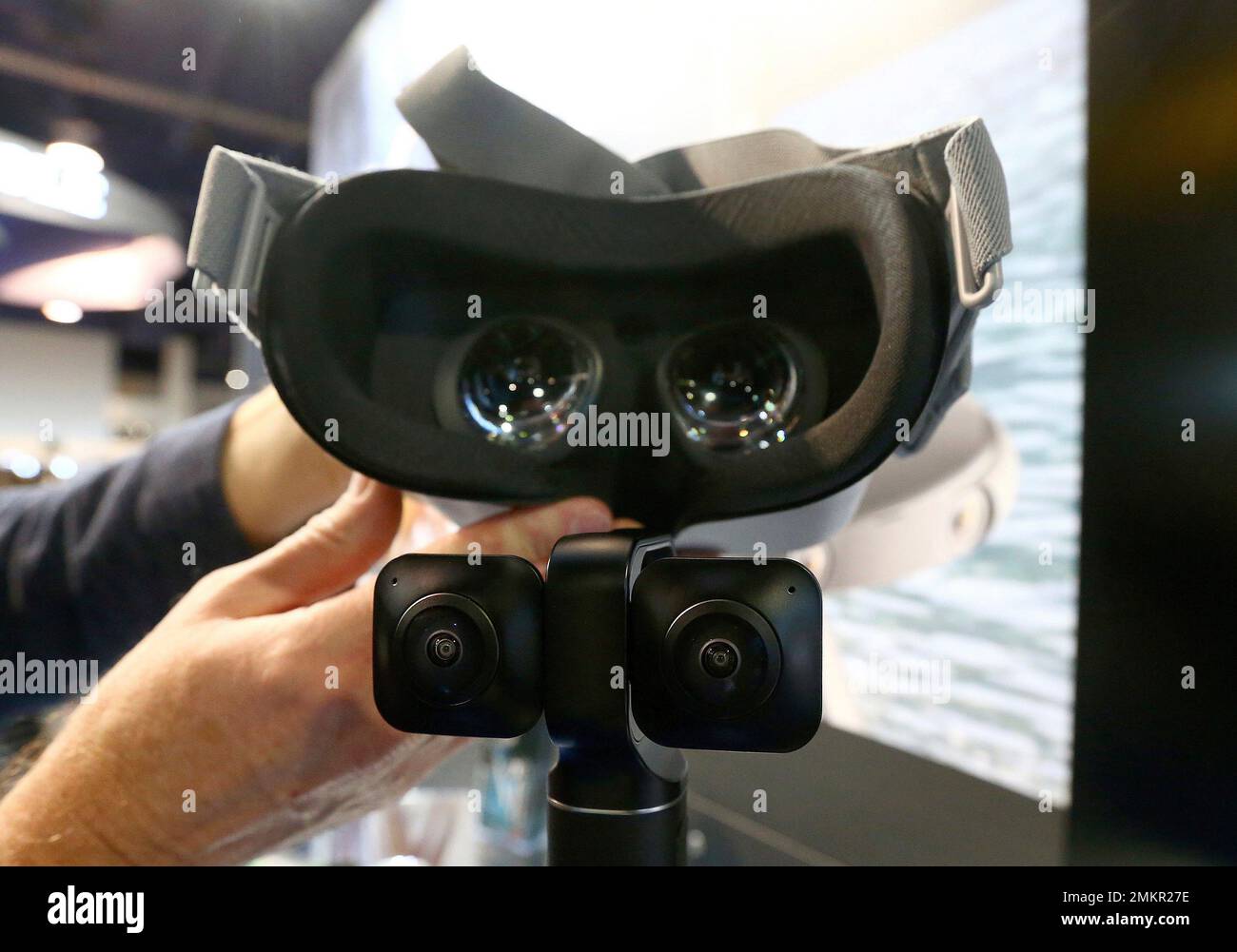 Human Eyes shows off their Vuze XR 3D 180-degree camera, bottom, with ...