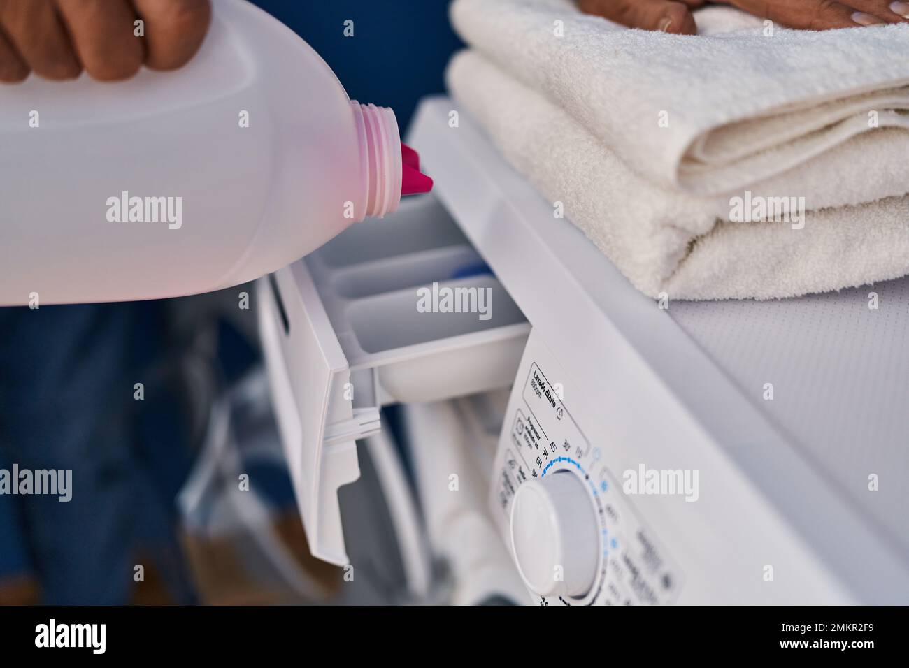 Person pouring fabric softener washing hi-res stock photography and ...