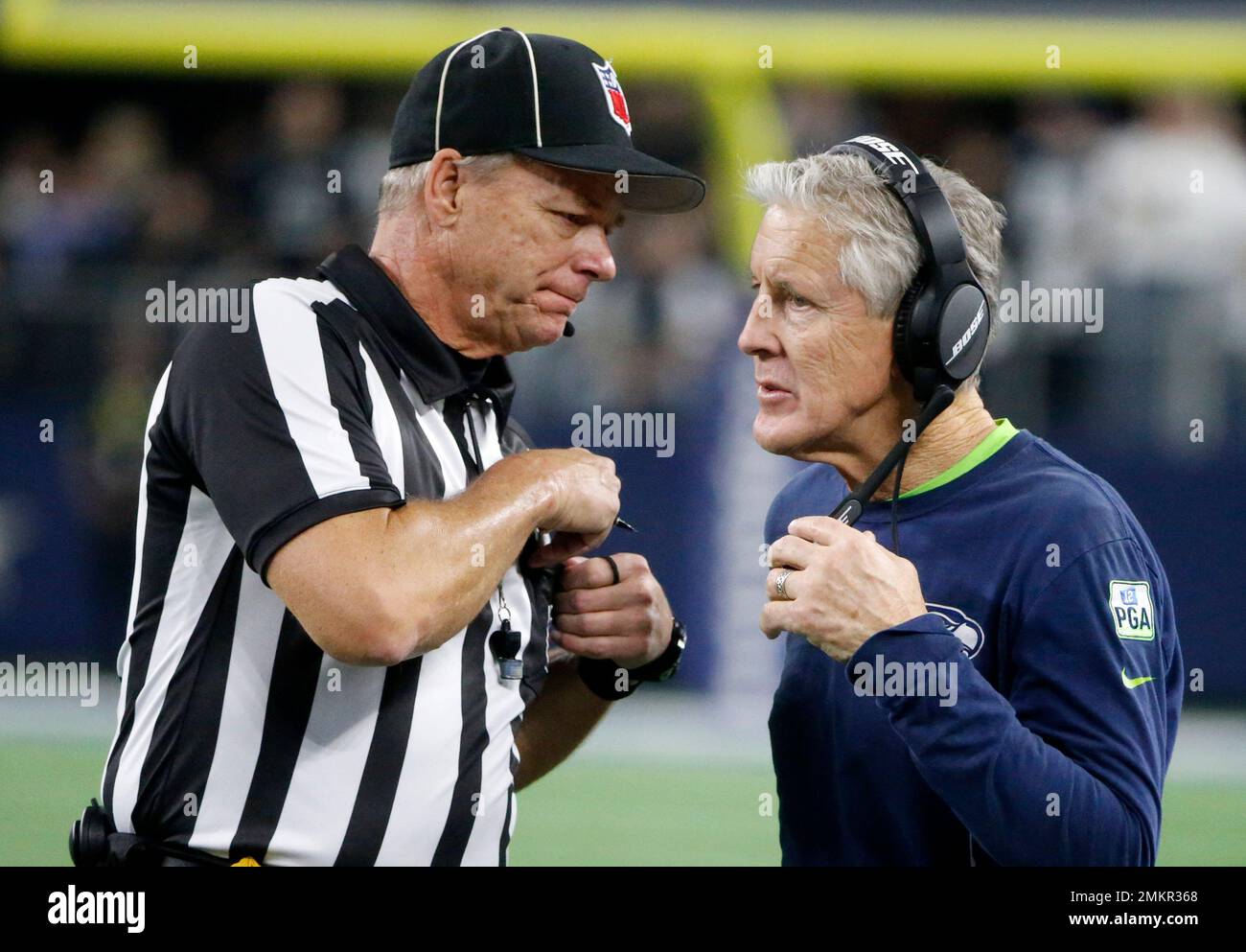 Seattle Seahawks head coach Pete Carroll, right, talks with an official ...