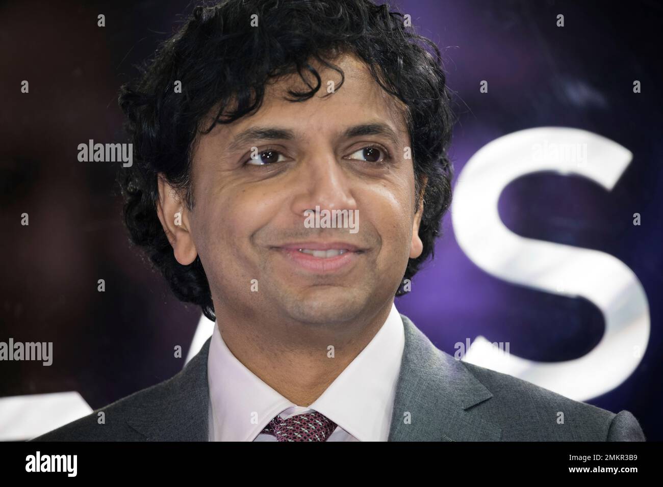 Director M. Night Shyamalan poses for photographers upon arrival at the ...