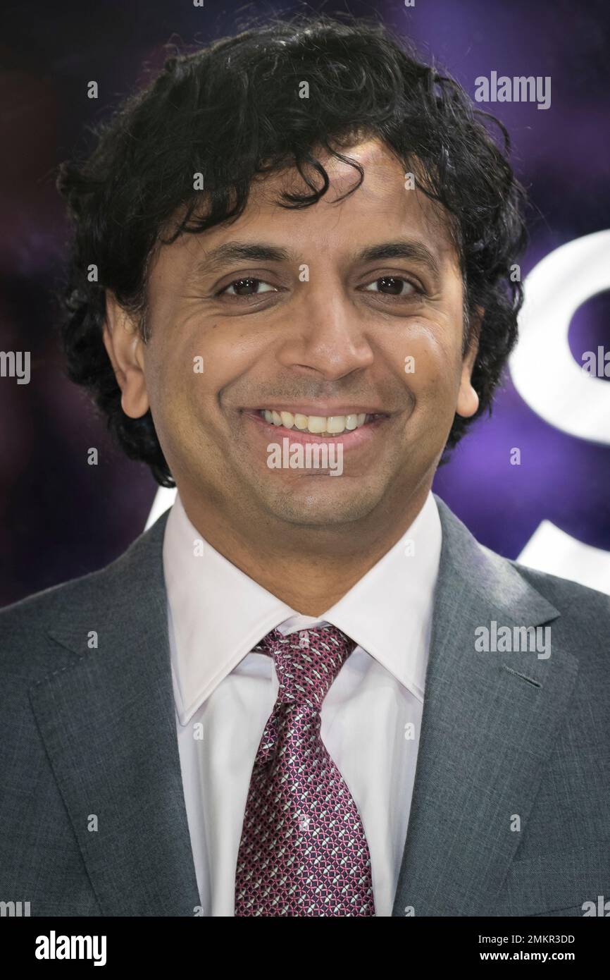 Director M. Night Shyamalan poses for photographers upon arrival at the ...
