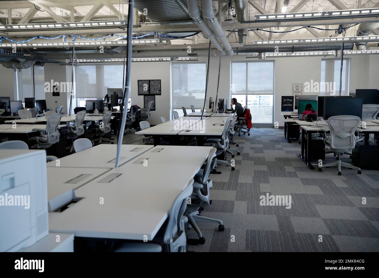 In this Jan. 9, 2019 photo, Facebook employees are seen at their ...