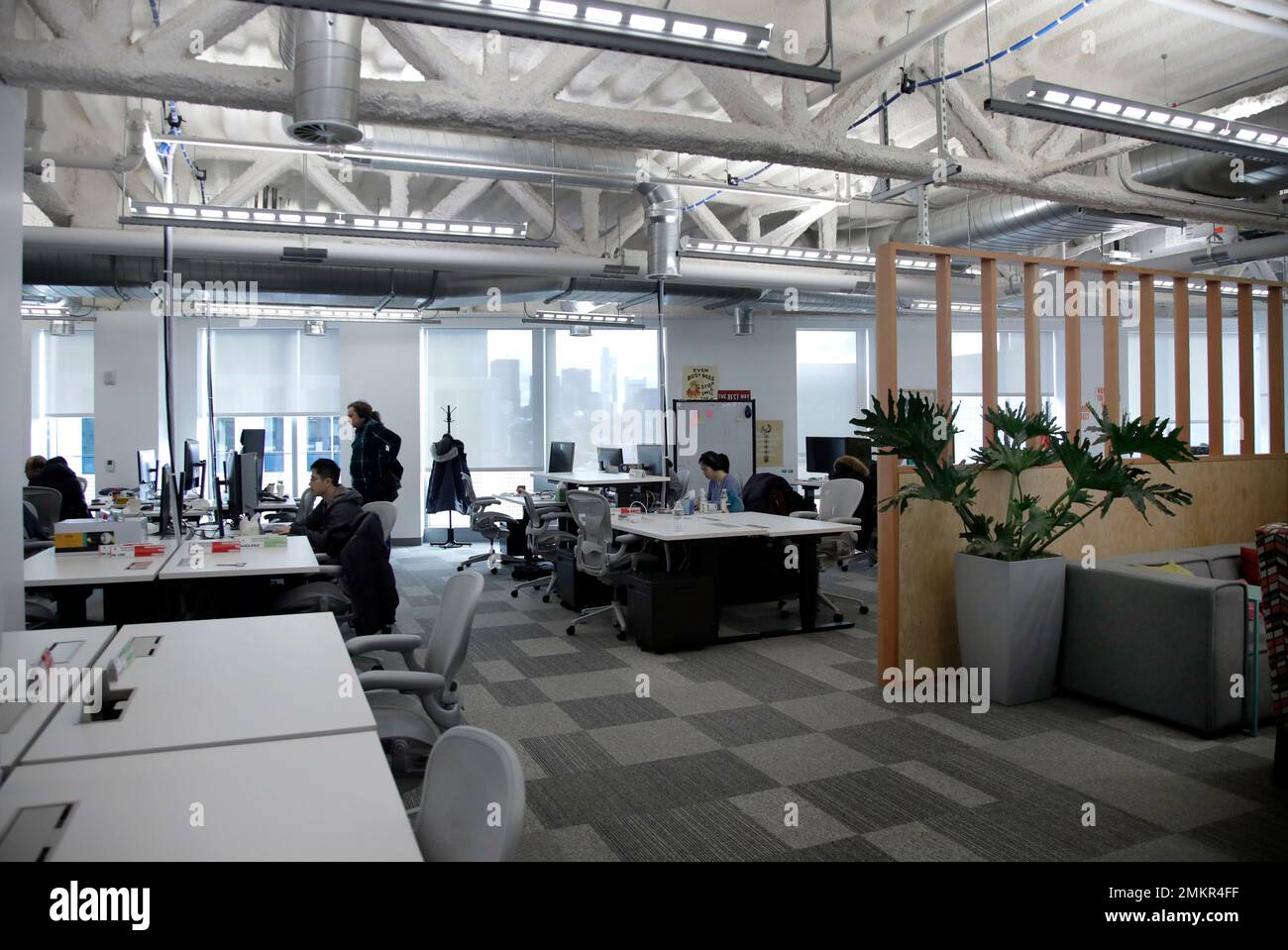 In this Jan. 9, 2019 photo, Facebook employees are seen at their ...
