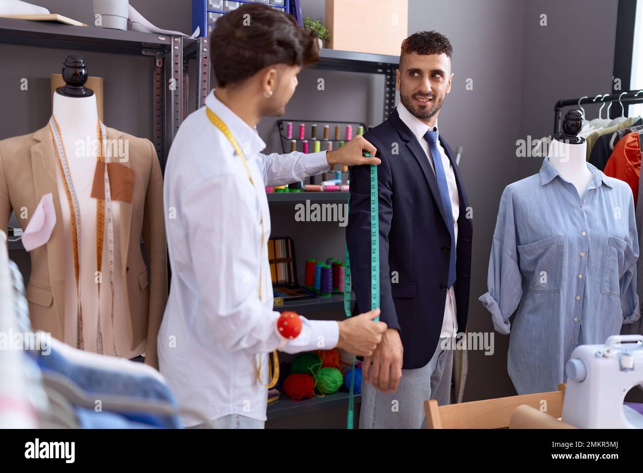 Handsome tailor measuring jacket hi-res stock photography and images ...