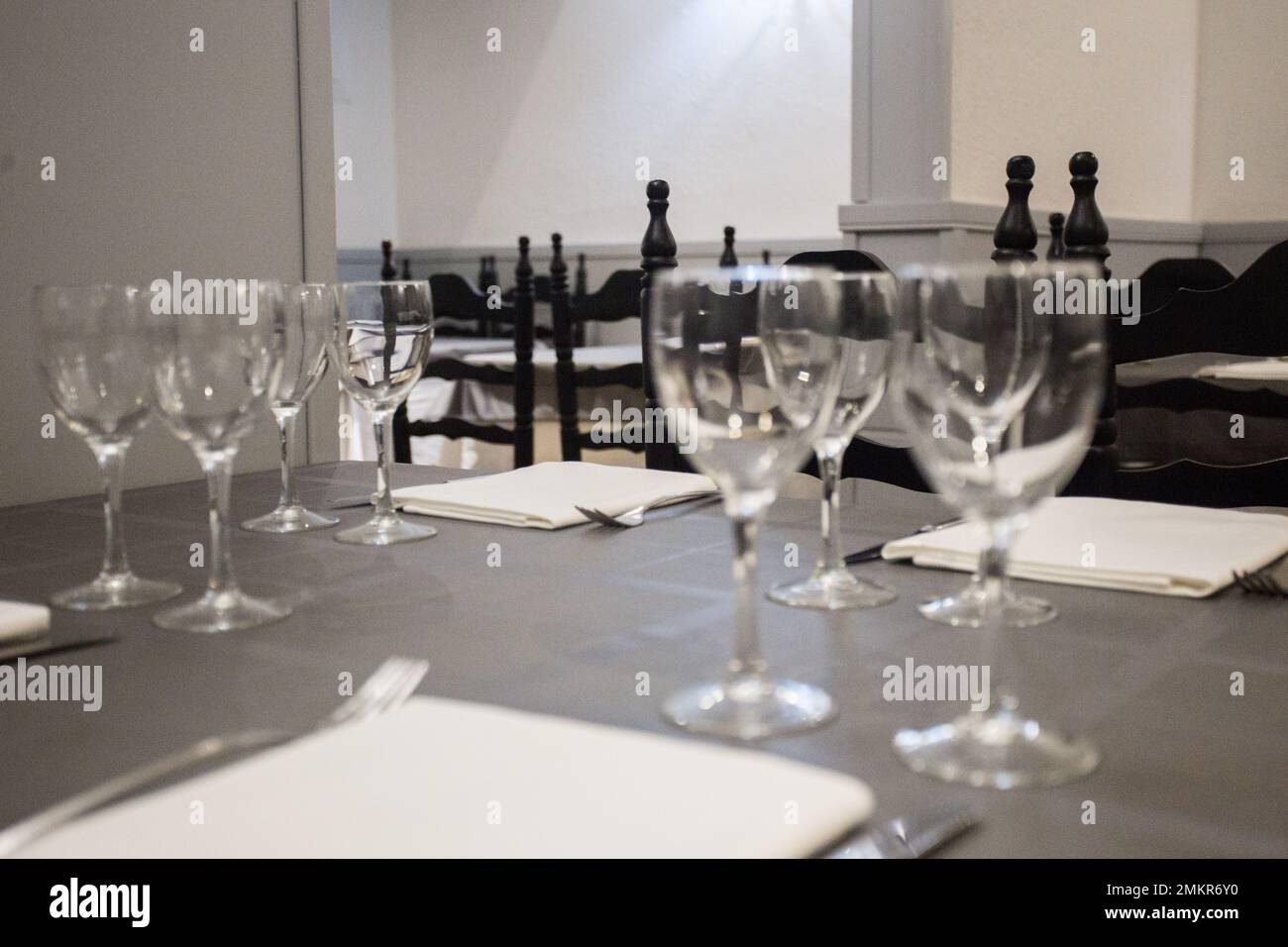 Elegant restaurant table with cutlery, crockery and glasses Stock Photo ...