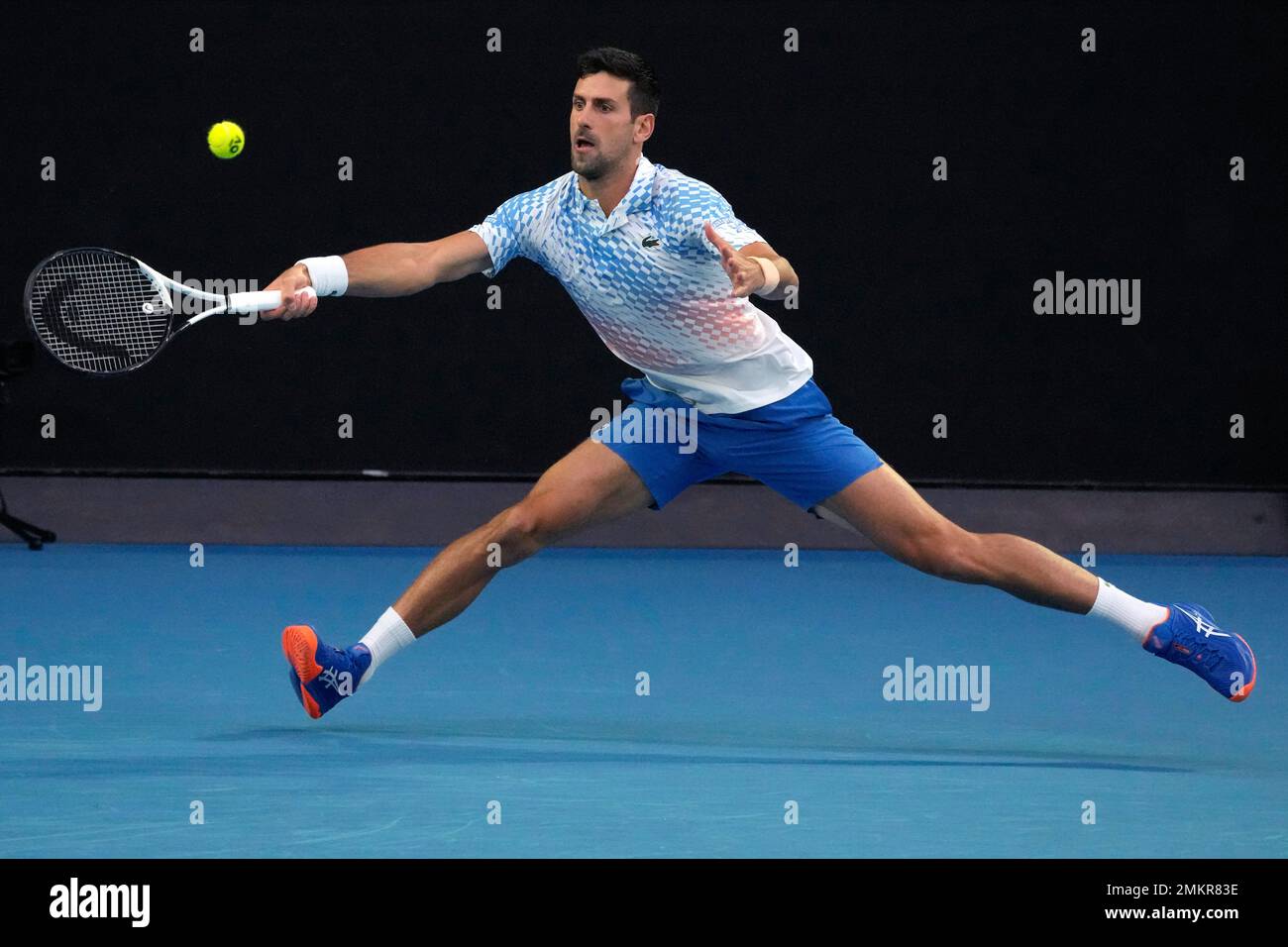 Novak Djokovic of Serbia plays a forehand return to Stefanos Tsitsipas ...