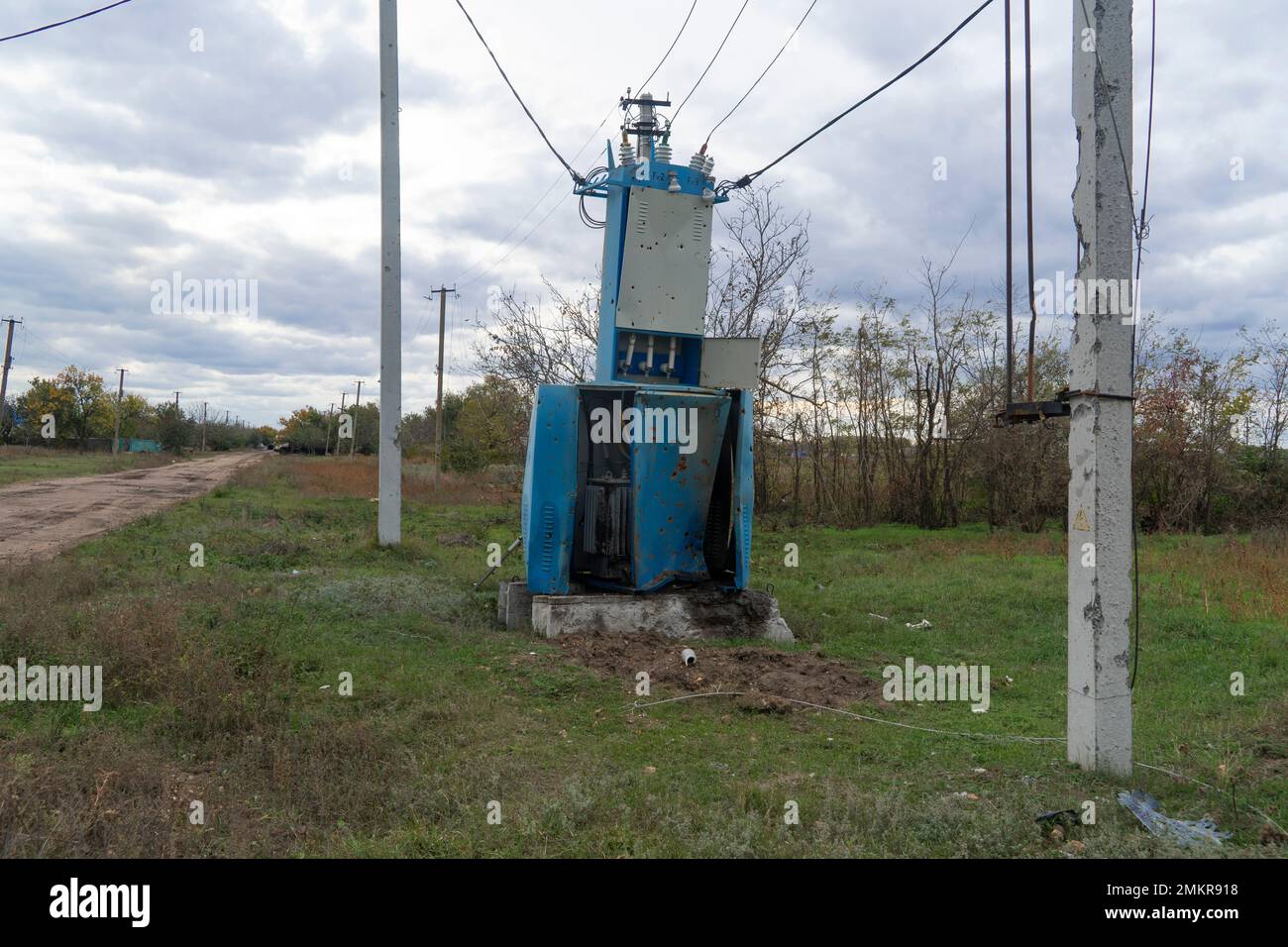 Countryside. Electrical transformer damaged by shelling. Destruction of ...