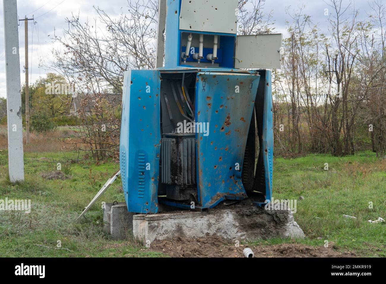 Countryside. Electrical transformer damaged by shelling. Destruction of ...