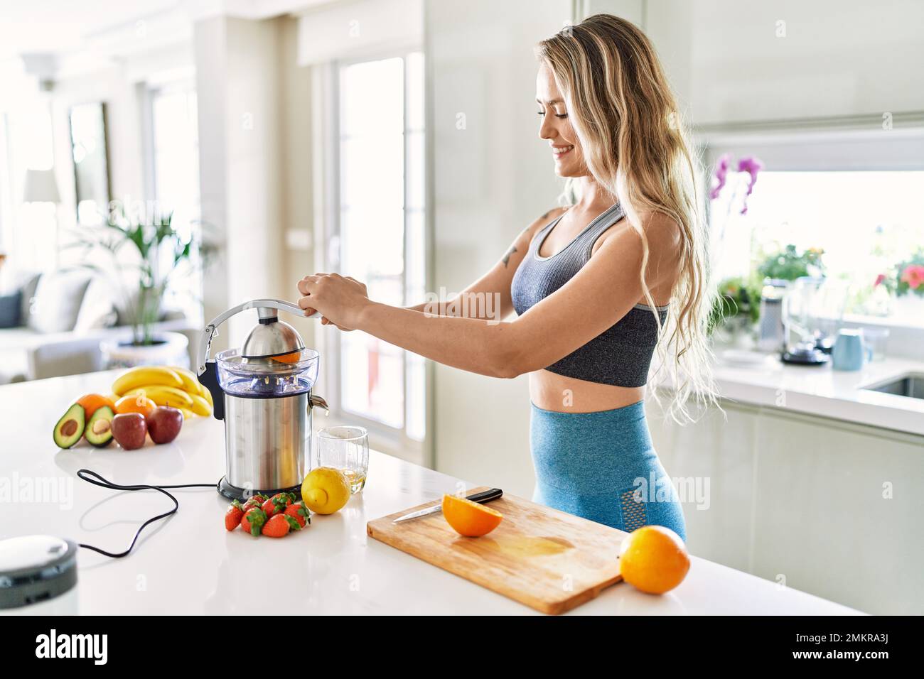 Young woman smiling confident using blender at kitchen Stock Photo - Alamy