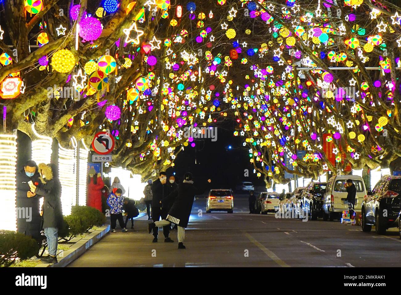 The colored lights on the wutong trees on both sides of the main road ...