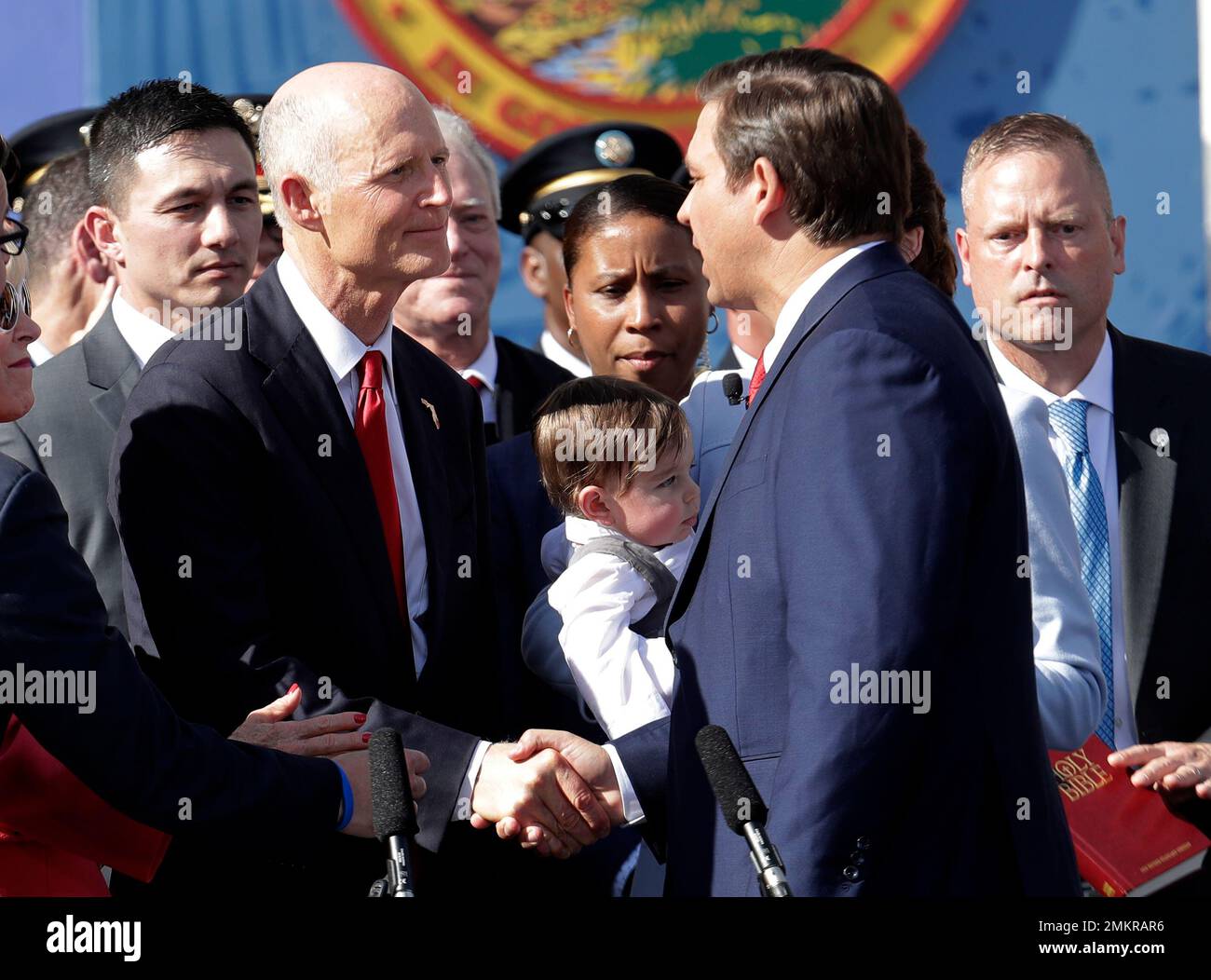 Florida Governor Ron DeSantis, right, shakes hands with former Governor ...