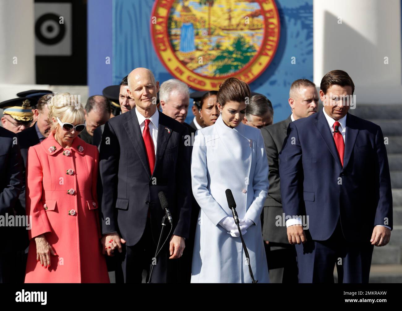 Ron DeSantis, right, and his wife Casey pray during an inauguration ...