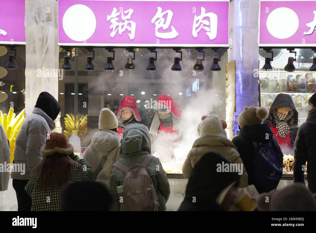Harbin, China's Heilongjiang Province. 28th Jan, 2023. Tourists buy ...