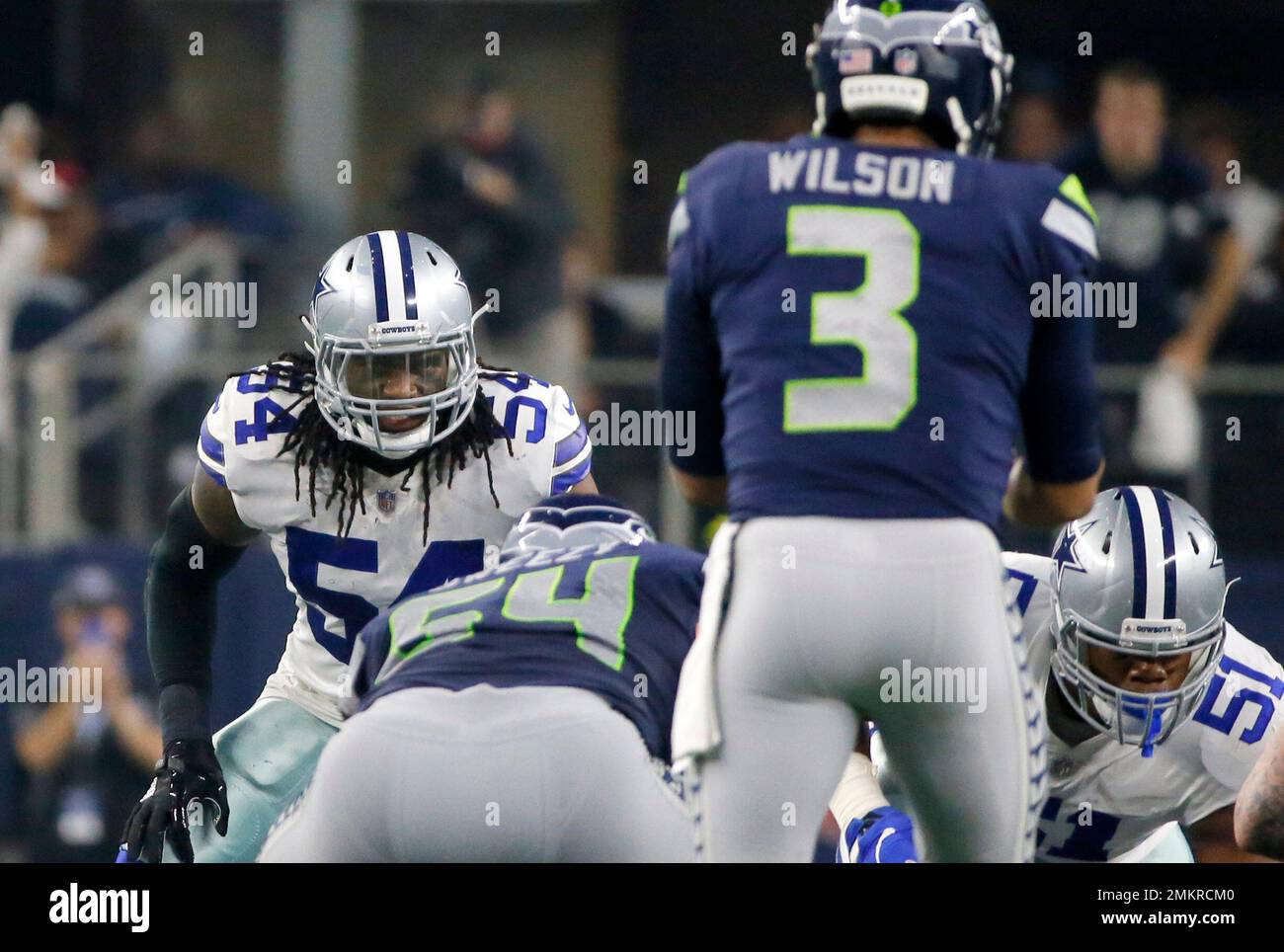 Dallas Cowboys linebacker Jaylon Smith, rear, lines up against Seattle ...