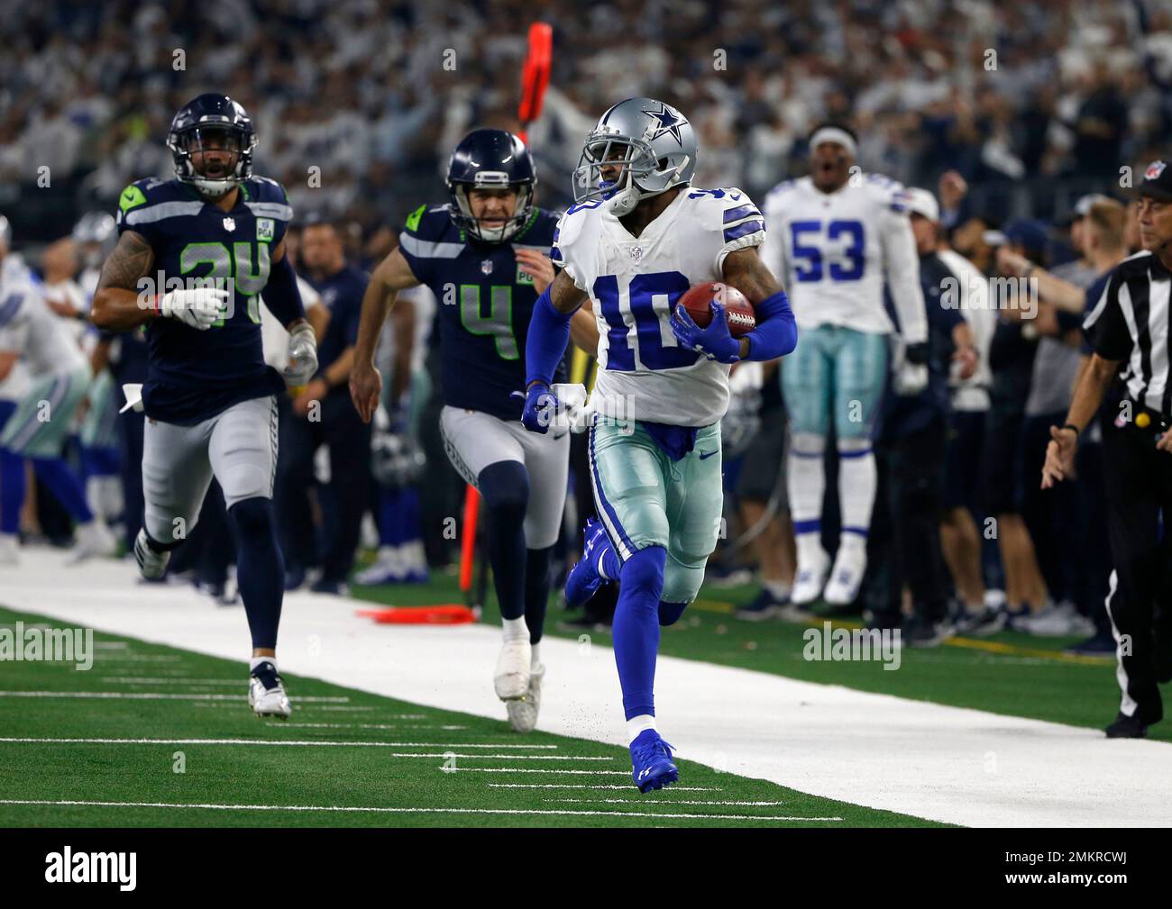 Seattle Seahawks punter Michael Dickson (4) gives chase as Dallas ...