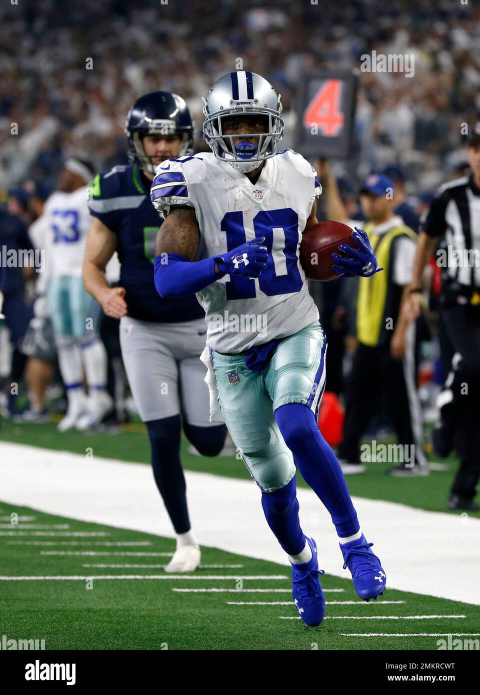 Seattle Seahawks punter Michael Dickson (4) gives chase as Dallas ...