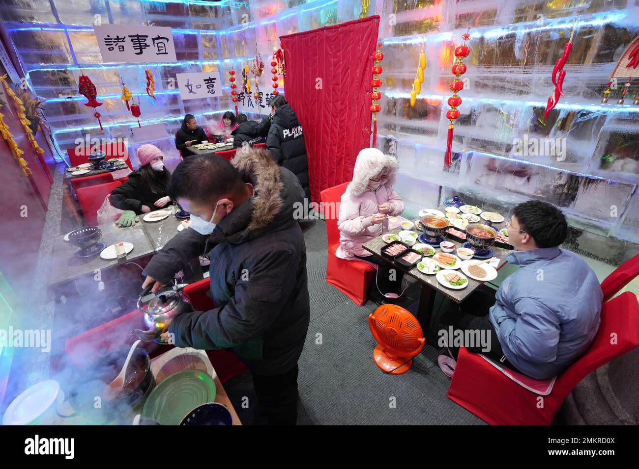 Harbin, China's Heilongjiang Province. 28th Jan, 2023. Tourists enjoy ...