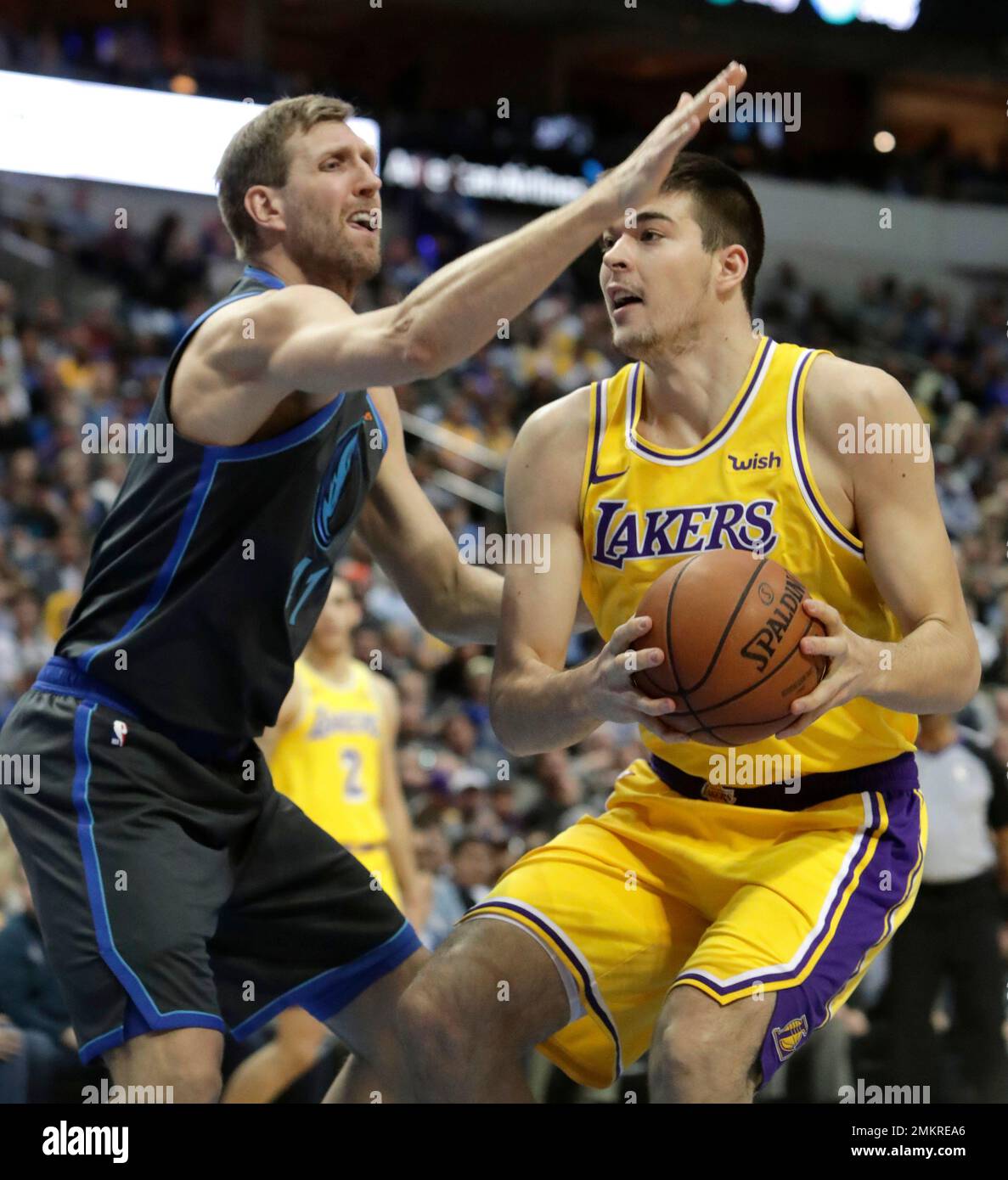 Los Angeles Lakers center Ivica Zubac, right, is defended by Dallas ...