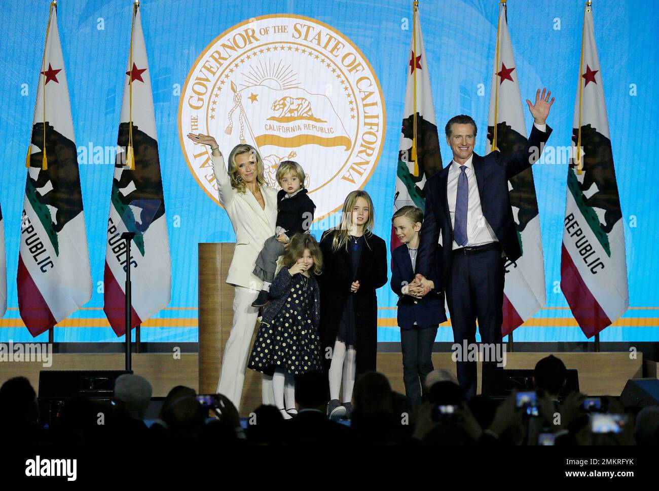 California Governor Gavin Newsom waves with his wife Jennifer Siebel ...