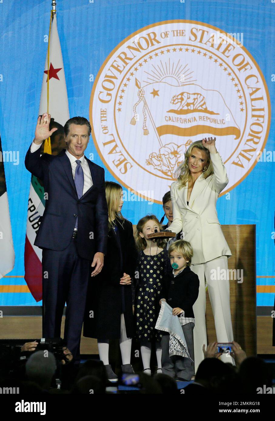 California Governor Gavin Newsom waves as his wife Jennifer Siebel ...