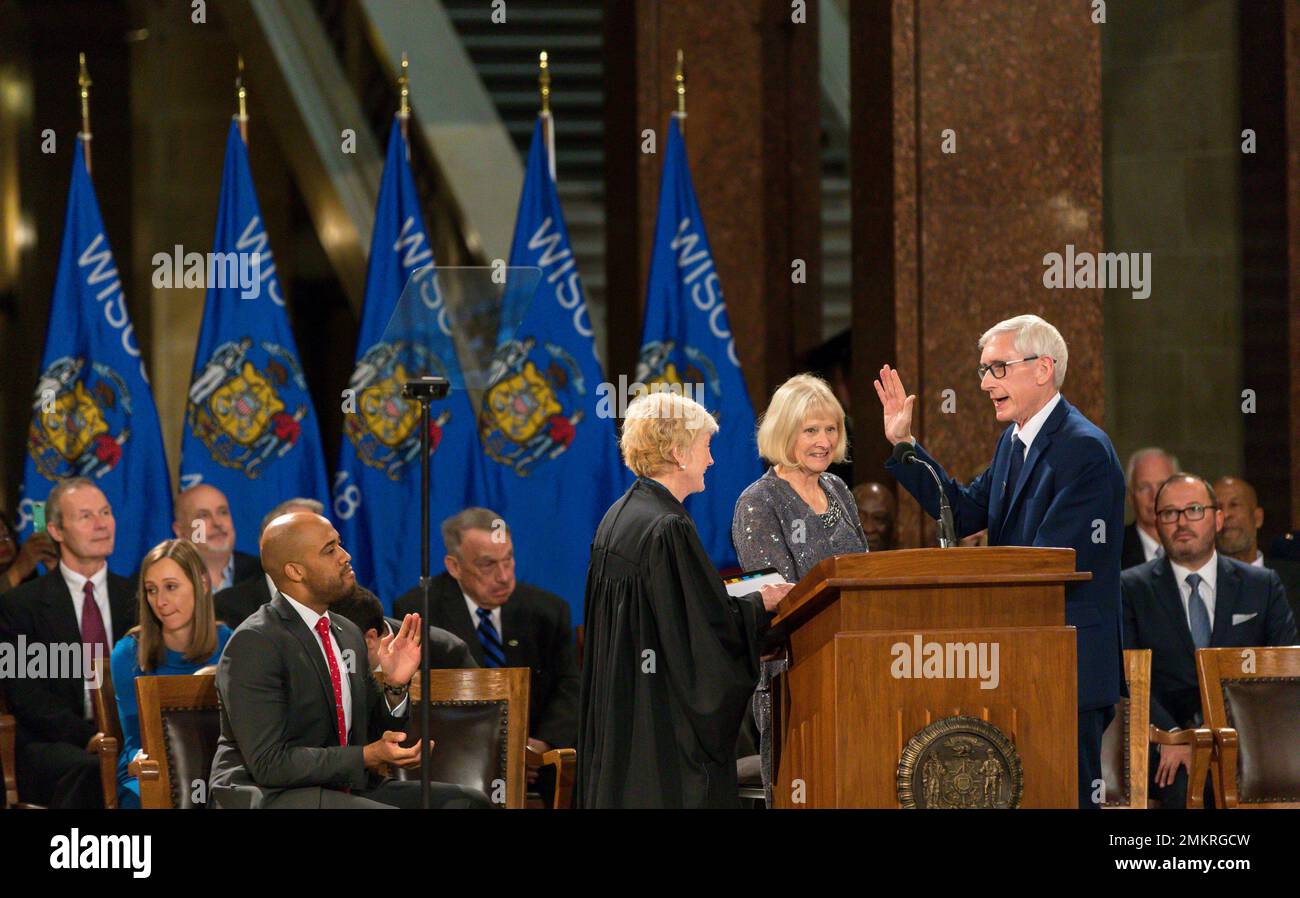 Wisconsin Gov. Tony Evers, right, is sworn in by Wisconsin Supreme ...