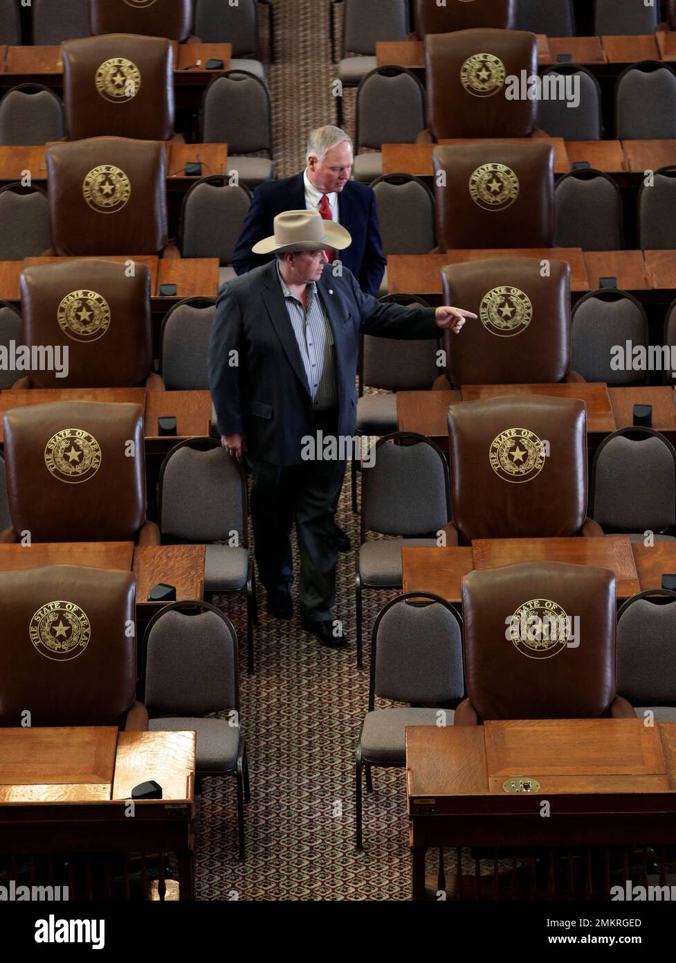 Rep. Cecil Bell, Jr., R-Magnolia, foreground visits the House Chamber ...