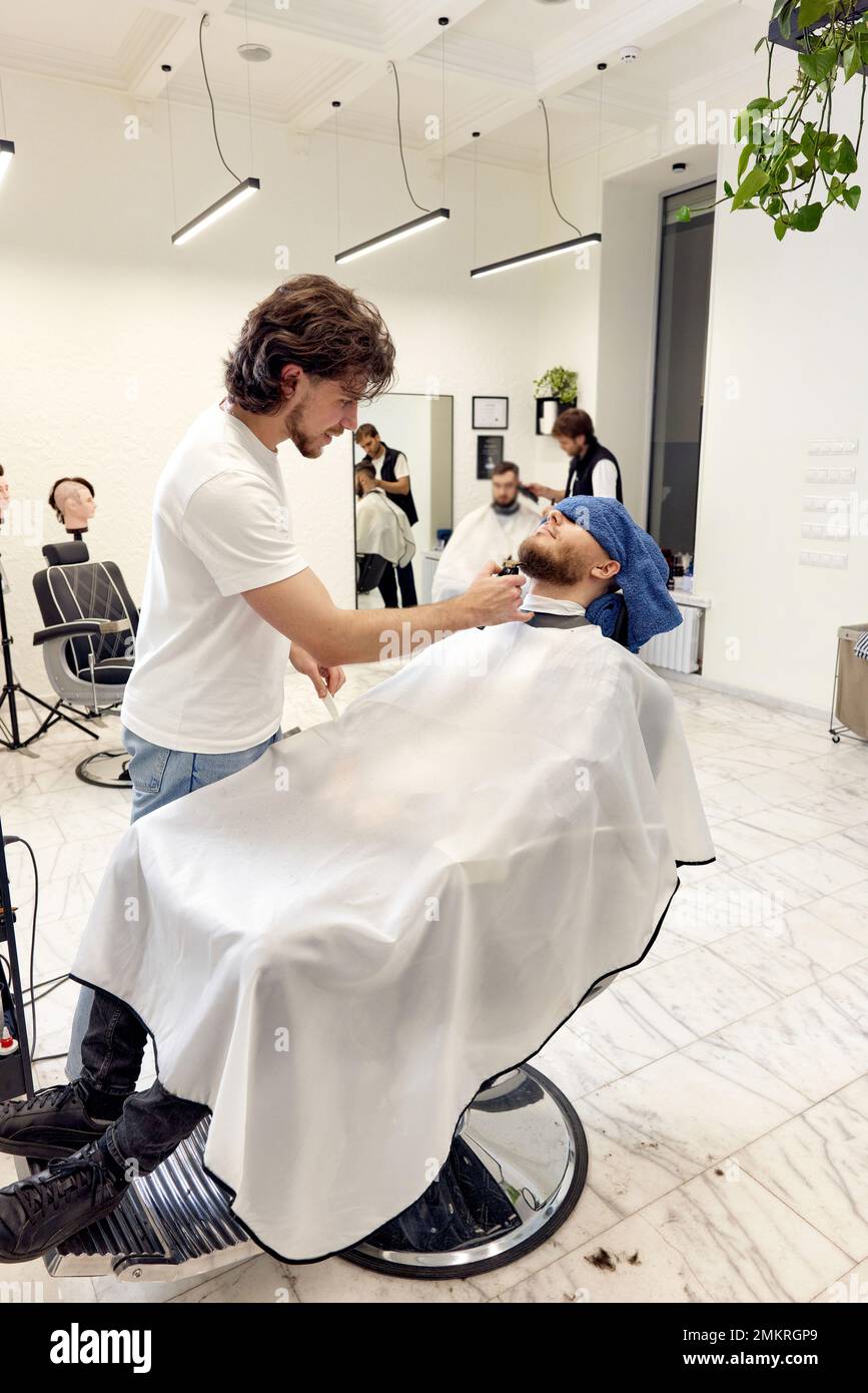 Accurate shaving in barber shop hi-res stock photography and images - Alamy