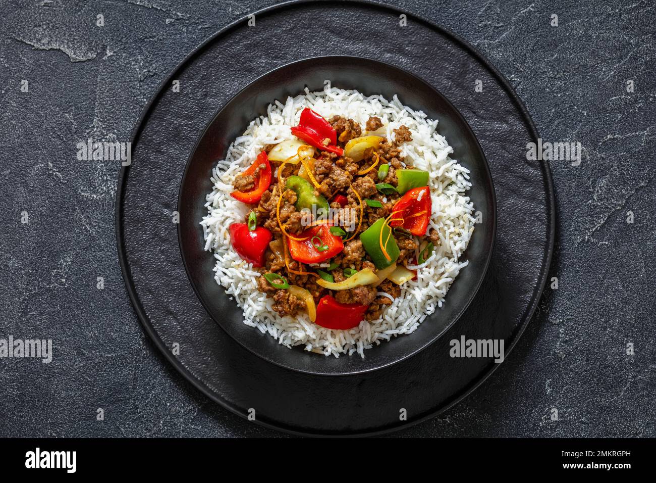 Crispy Ground Beef With Stir Fried Veggies And A Sticky Sweet Orange Sauce Topped On Rice In