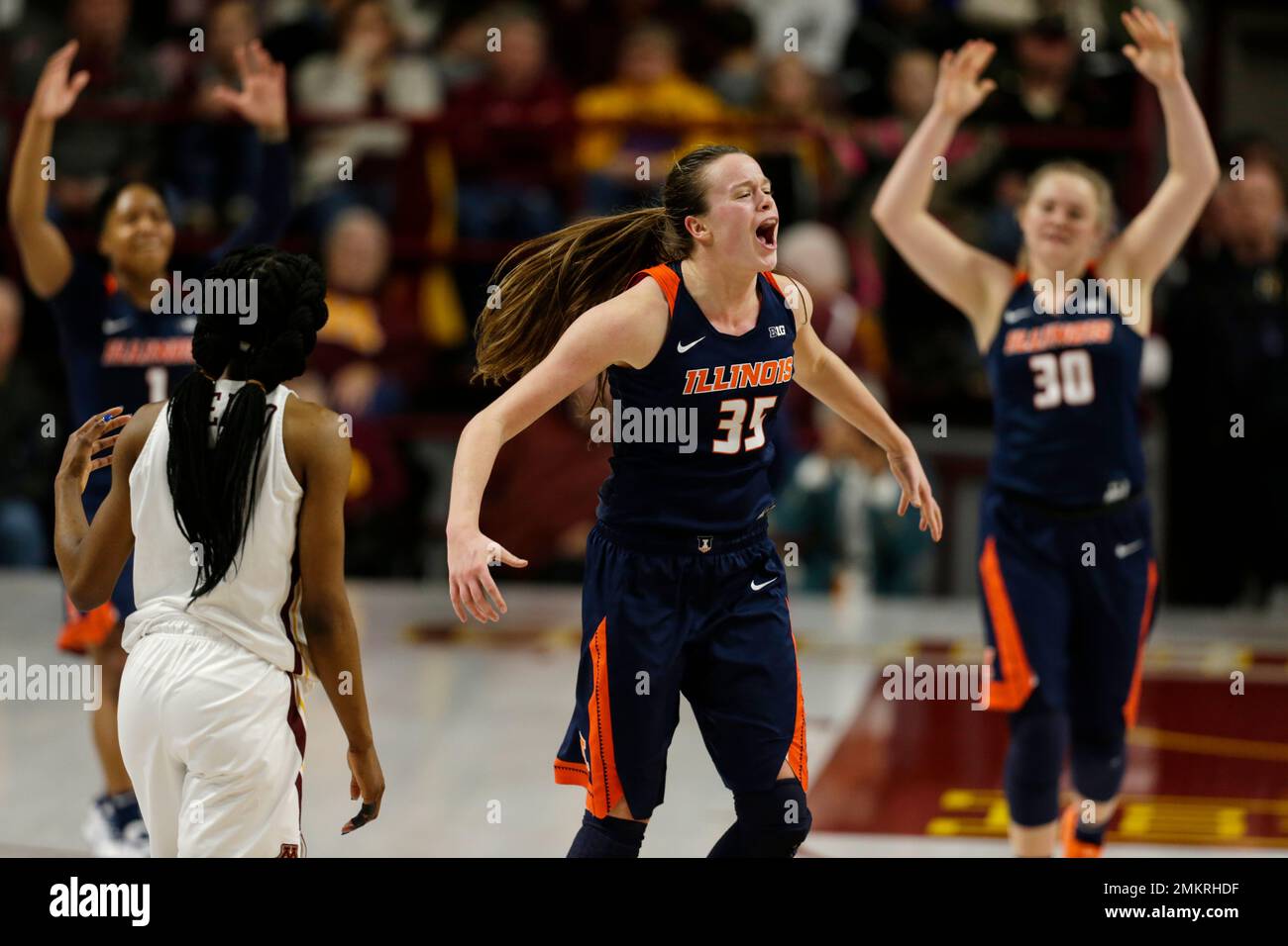 Illinois guard Alex Wittinger (35), Courtney Joens (30) and Brandi ...