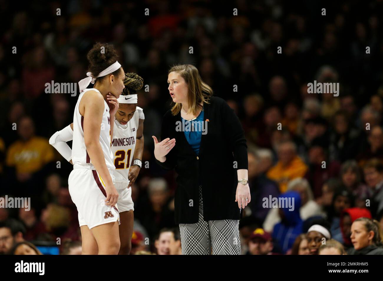 Minnesota head coach Lindsay Whalen talks to Destiny Pitts and Jasmine ...