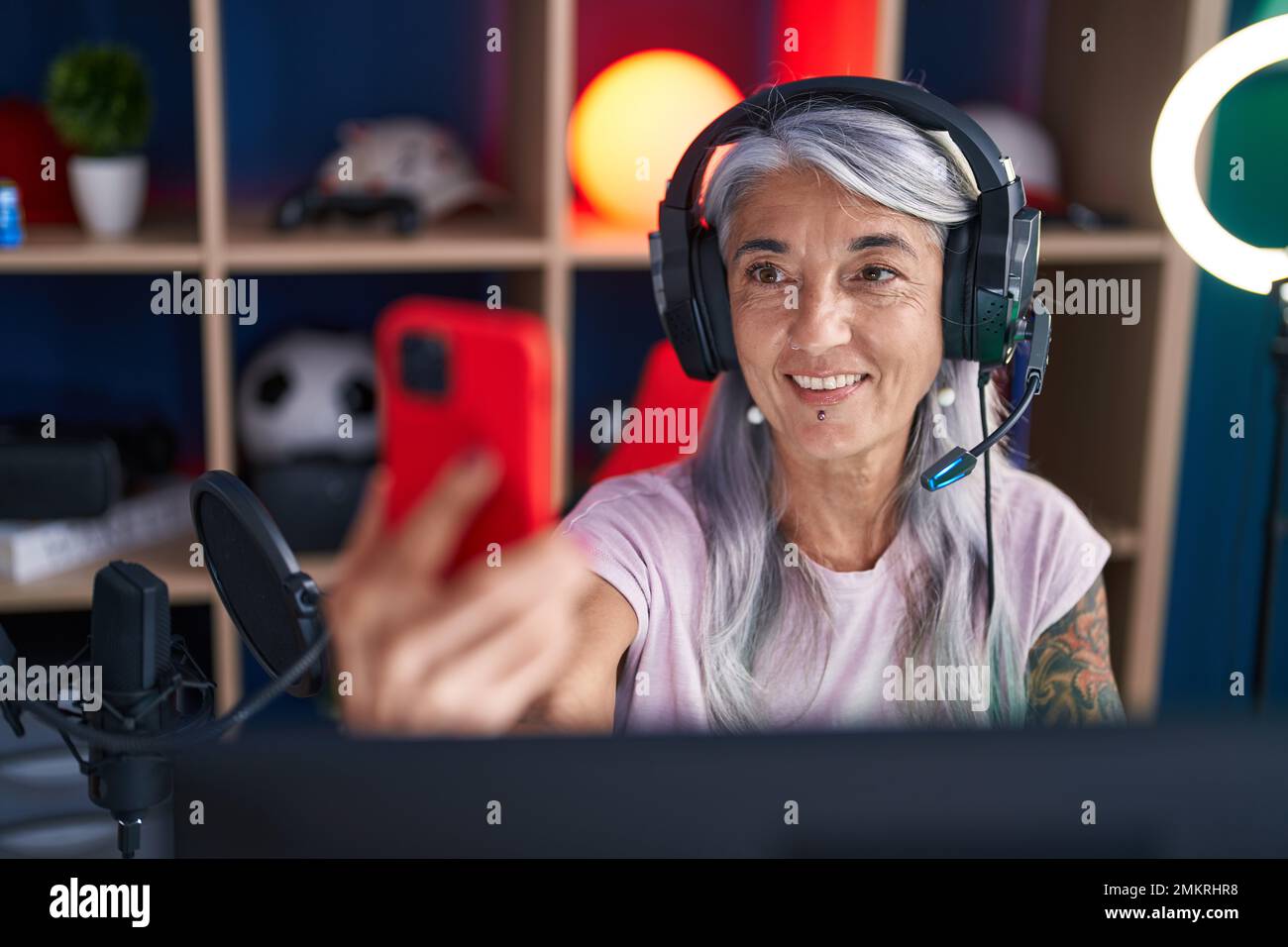 Middle age grey-haired woman streamer smiling confident make selfie by ...