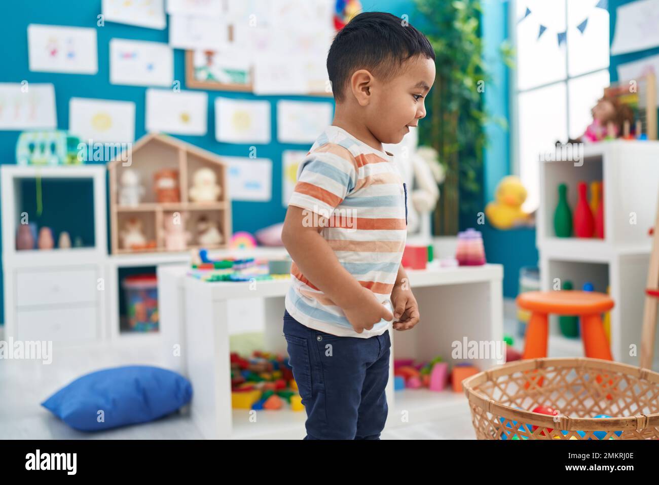 Adorable hispanic toddler smiling confident standing at kindergarten ...