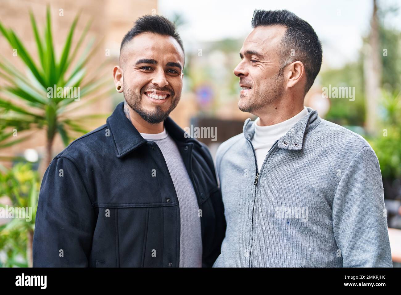 Two men couple smiling confident standing together at street Stock ...