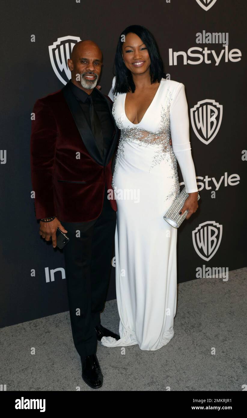 Ted Bunch, left, and Garcelle Beauvais arrive at the InStyle and Warner ...