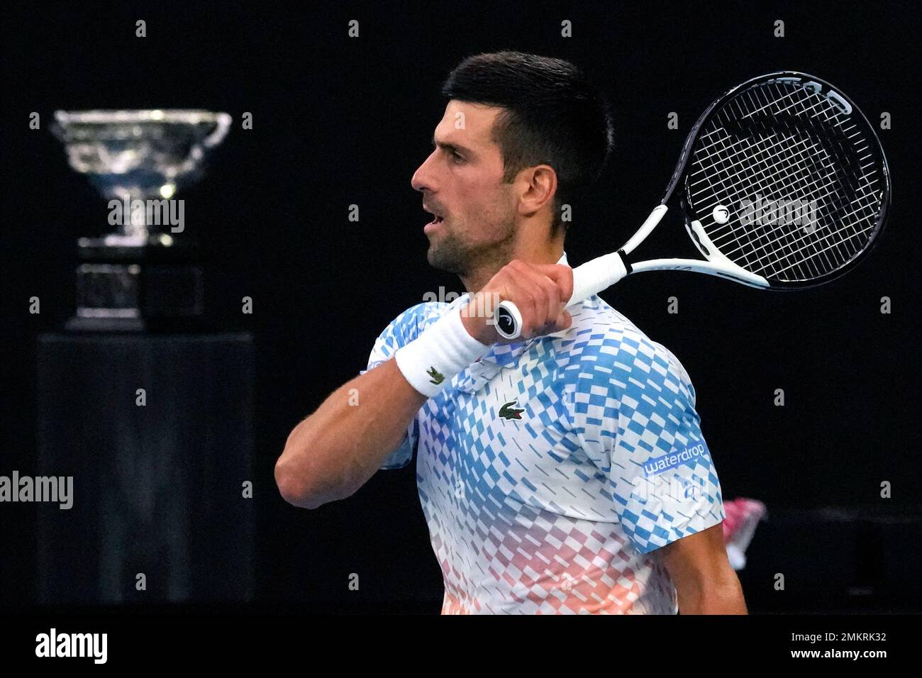 Novak Djokovic of Serbia plays a forehand return to Stefanos Tsitsipas ...