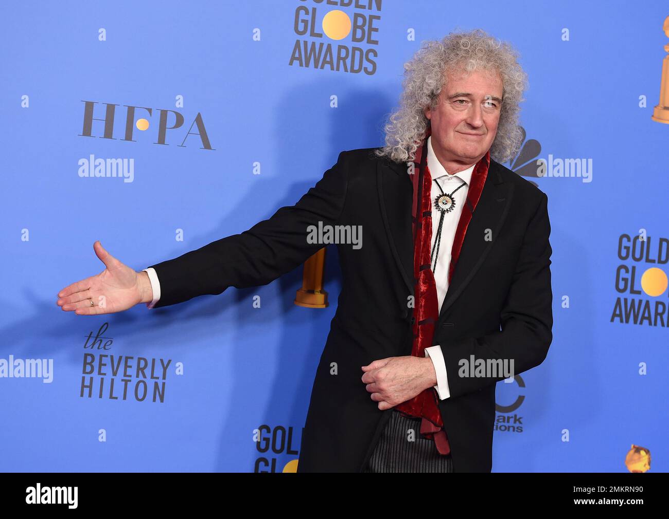 Brian May, of Queen, poses in the press room at the 76th annual Golden ...