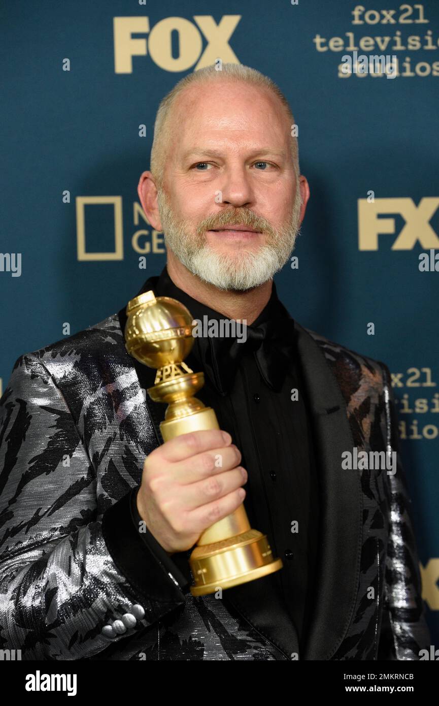 Ryan Murphy poses with the award for best television limited series or ...