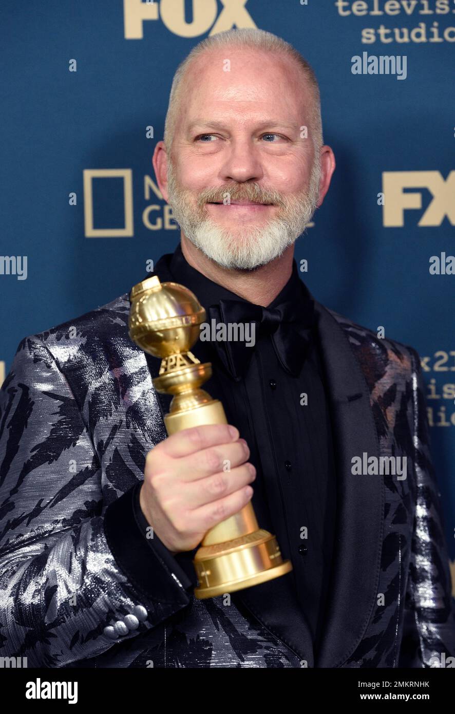 Ryan Murphy poses with the award for best television limited series or ...