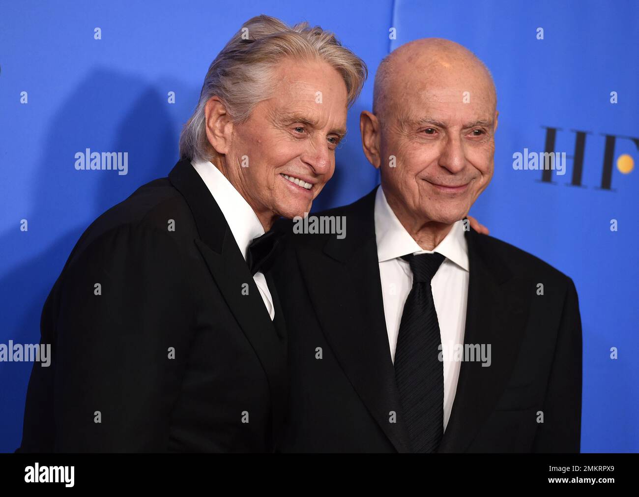 Michael Douglas, left, and Alan Arkin pose in the press room with the ...