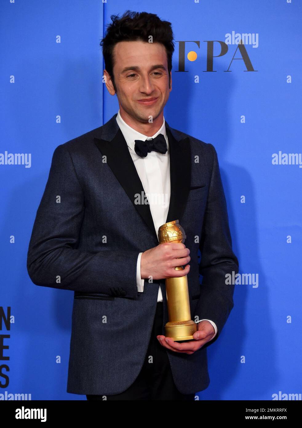 Justin Hurwitz poses in the press room with the award for best original ...