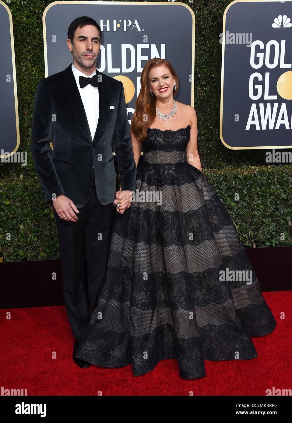 Sacha Baron Cohen, left, and Isla Fisher arrive at the 76th annual ...