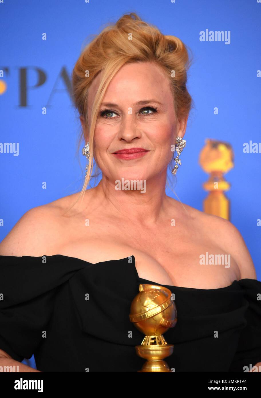 Patricia Arquette poses in the press room with the award for best ...