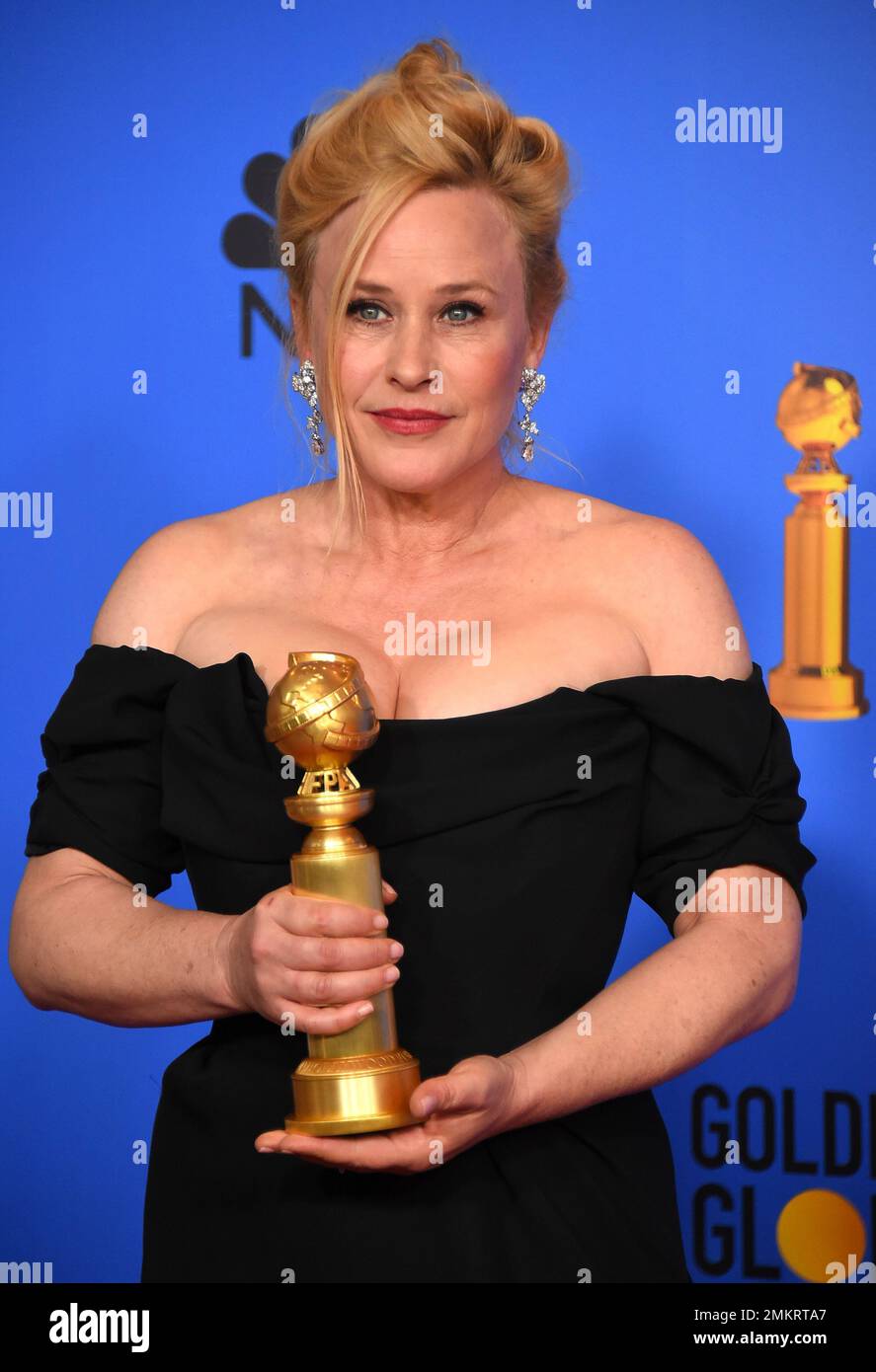 Patricia Arquette poses in the press room with the award for best ...