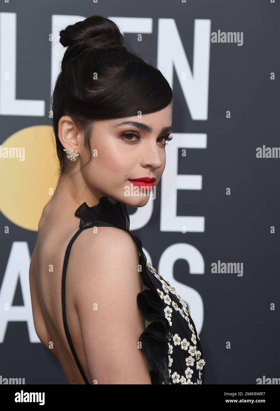 Sofia Carson holds a Times Up ribbon as she arrives at the 76th annual ...