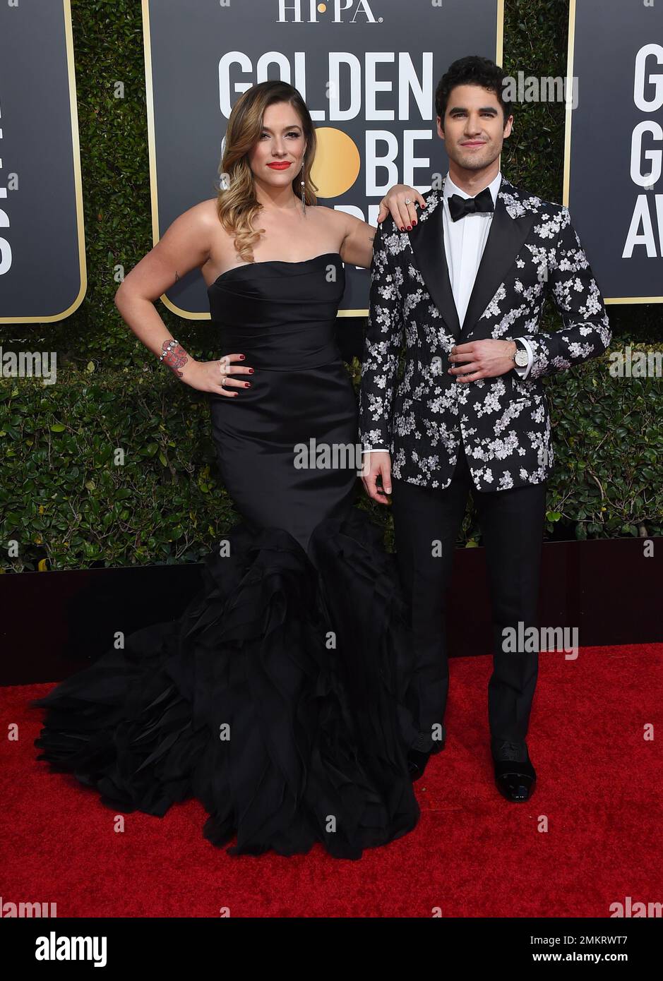 Mia Swier, left, and Darren Criss arrive at the 76th annual Golden ...