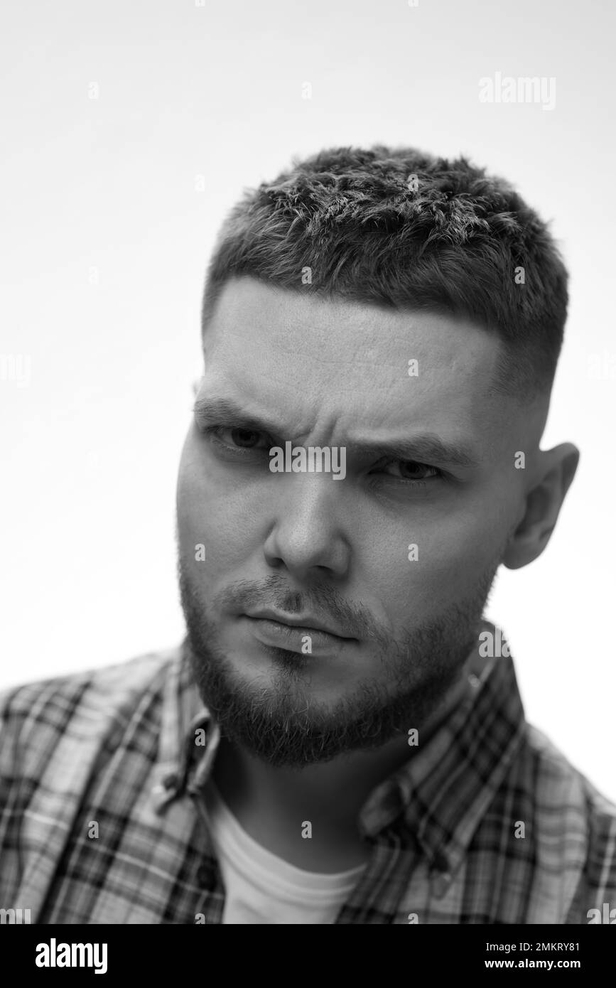 Confident bearded man holding Black and White Stock Photos & Images - Alamy