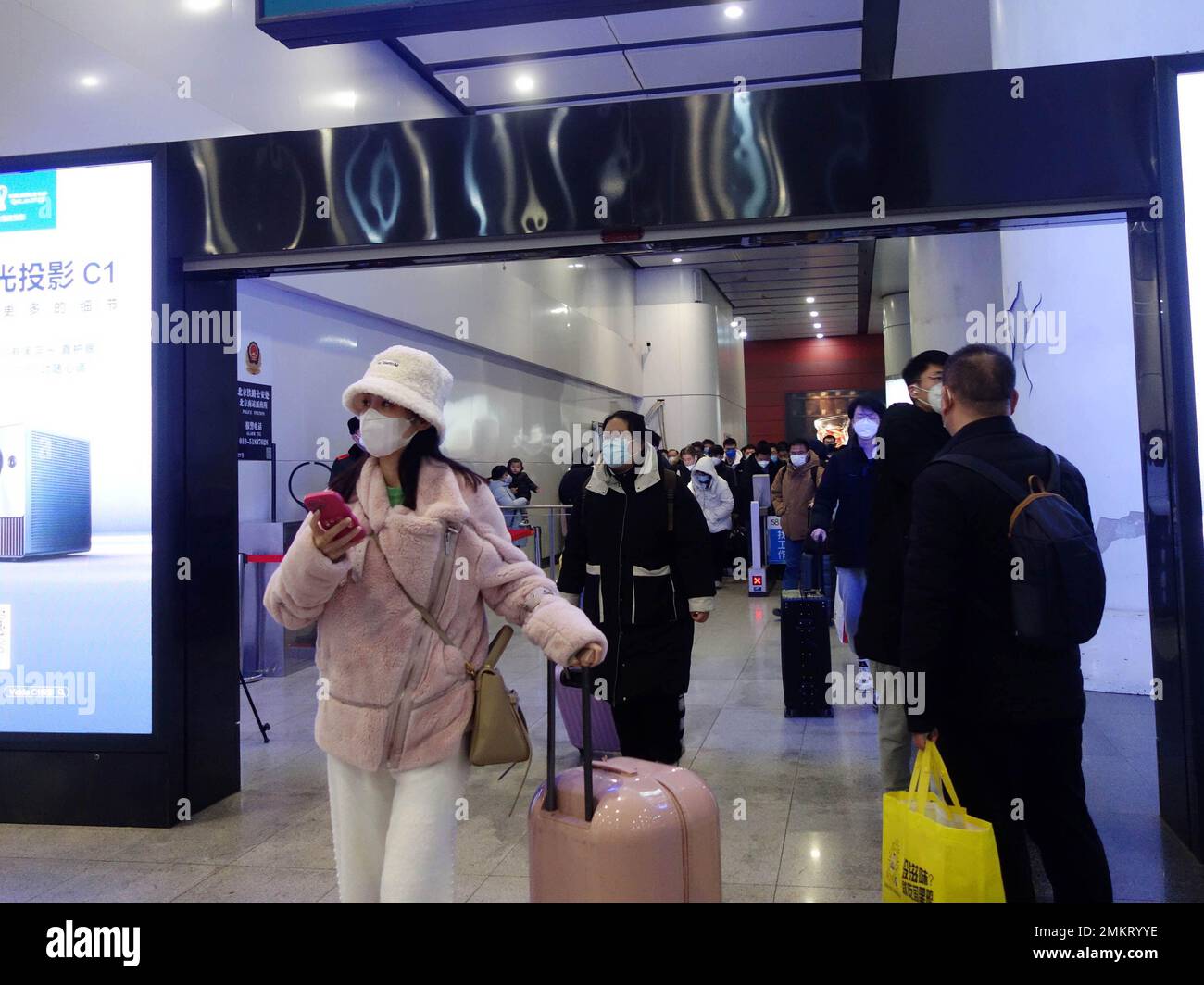BEIJING, CHINA -JANUARY 29, 2023 - Passengers walk out of the Beijing ...