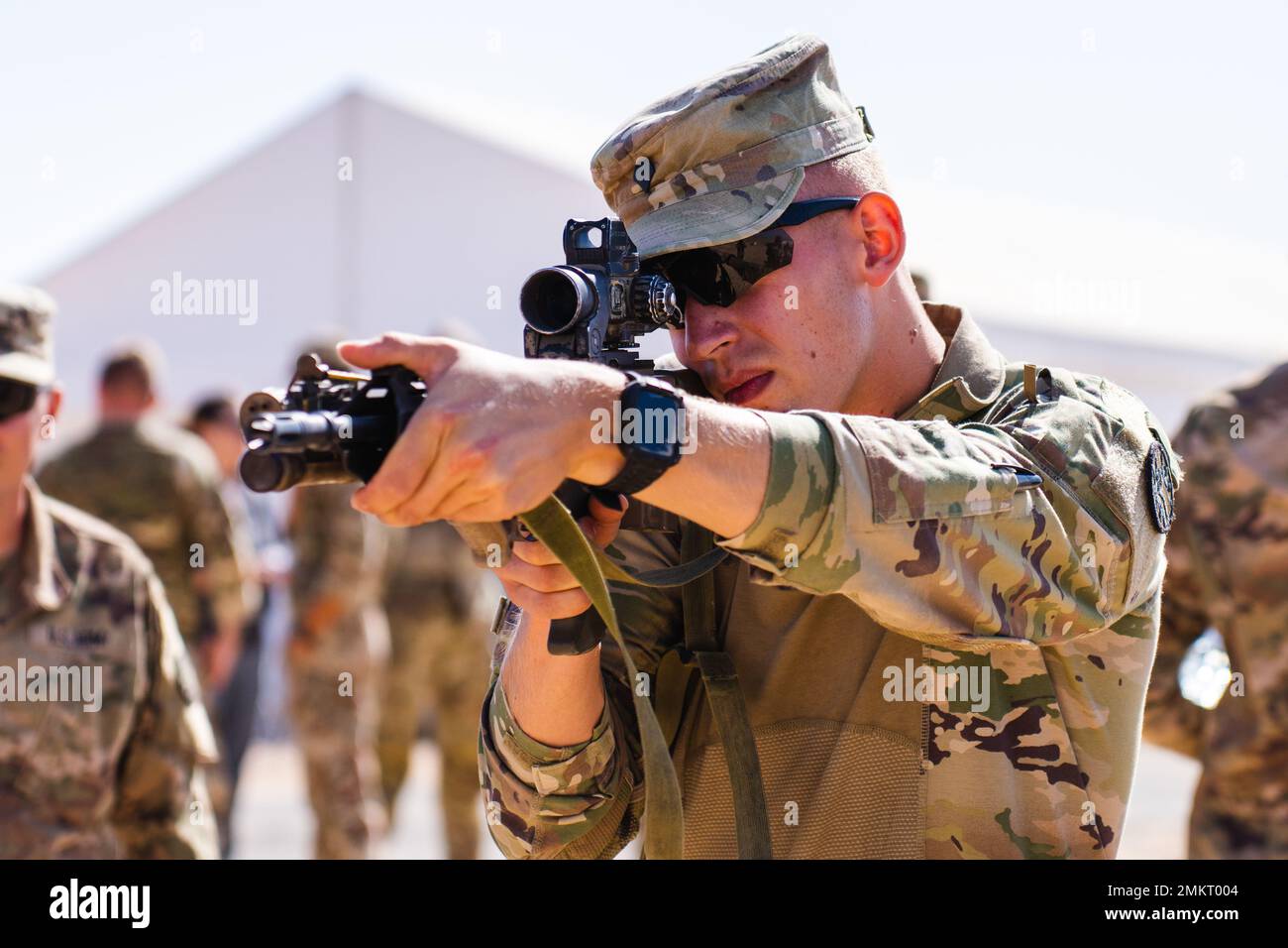 U.S. Army Spc. Bryan Hutchins conducts a weapons familiarization ...
