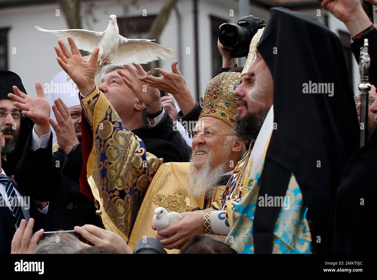 Ecumenical Patriarch Bartholomew I, center, Metropolitan Epiphanius ...