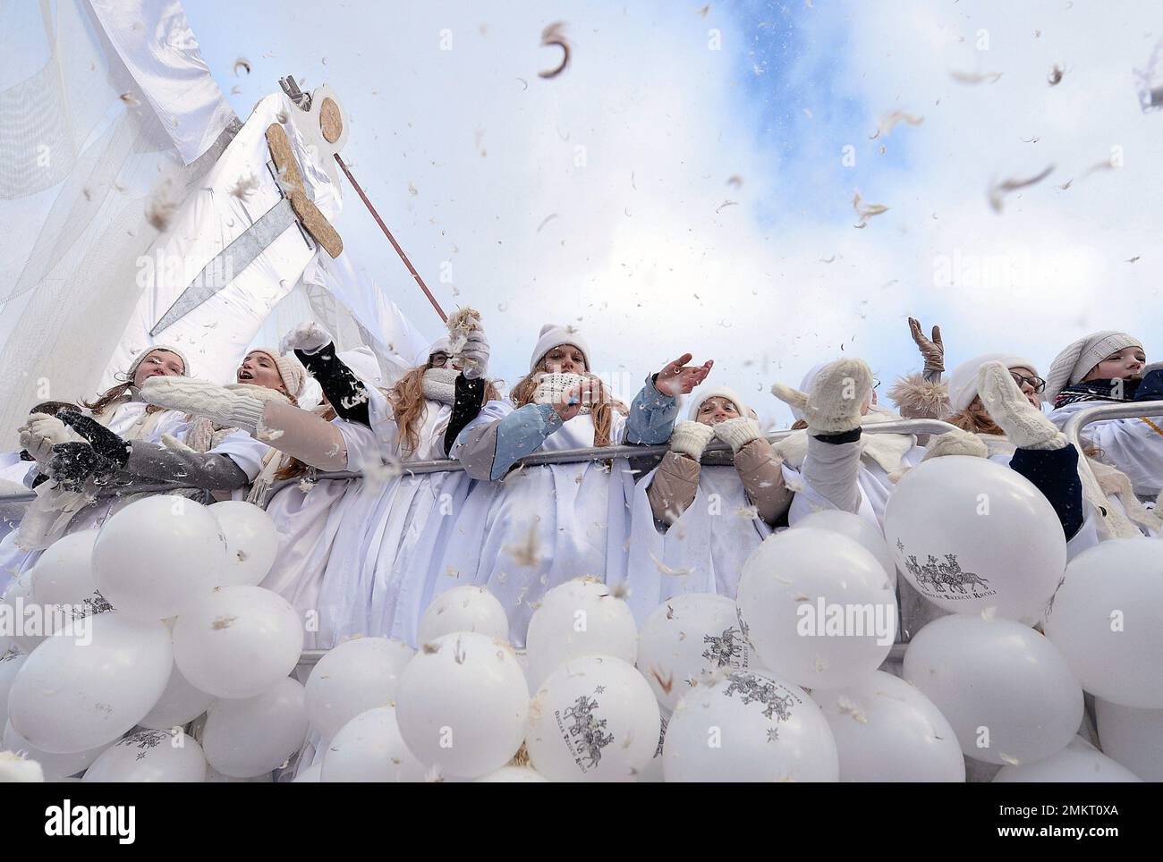 People walk in the crowd of some 40,000 in an Epiphany procession pageant in the crowd of some ...